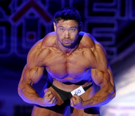 Bodybuilder Competes During Mens Bodybuilding Championship Editorial ...