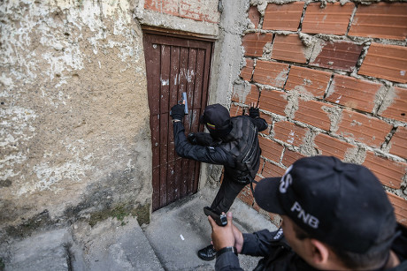 Special Actions Police Force (FAES) during raid in a Caracas slum ...