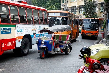 Tuktuk Maneuvers Among Large Buses During Editorial Stock Photo - Stock ...