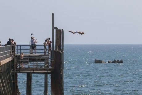 People Jump Off Jetty Glenelg Beach Editorial Stock Photo - Stock Image ...