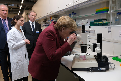 German Chancellor Angela Merkel Looks Through Editorial Stock Photo ...