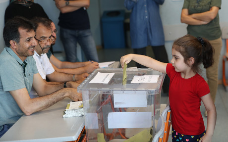 Child Puts Ballot Inside Box During Editorial Stock Photo - Stock Image ...