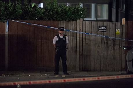 Police Officer Standing Near Garage Area Editorial Stock Photo - Stock ...