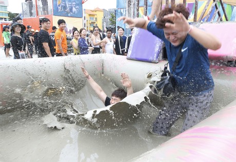 Festivalgoers Jump Into Mud Pool During Editorial Stock Photo - Stock ...