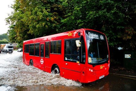 Red London Bus Splashes Through Flood Editorial Stock Photo - Stock ...