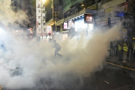 Protester Runs Amidst Tear Gas Smoke Editorial Stock Photo - Stock ...