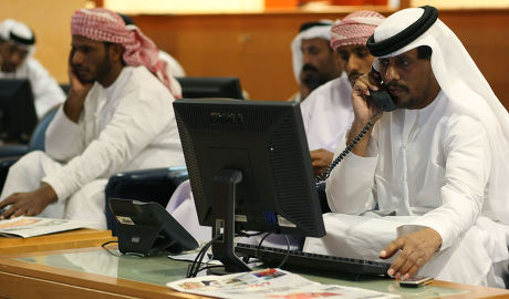 __COUNT__ Emirati traders at the Abu Dhabi Securities Market, Al Ghaith ...