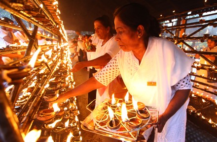 Sri Lankan Buddhist Devotees Light Lamps Editorial Stock Photo - Stock ...