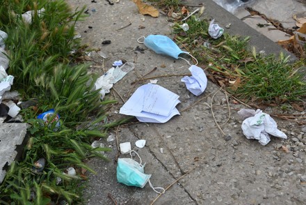 Discarded Face Masks Lie On Ground Editorial Stock Photo - Stock Image ...