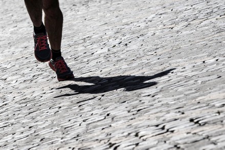 Participant Casts Shadow On Grey Cobblestone Editorial Stock Photo ...