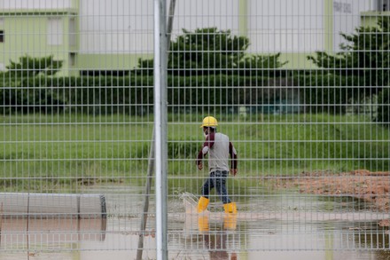 Worker Walks Through Puddle Construction Site Editorial Stock Photo ...