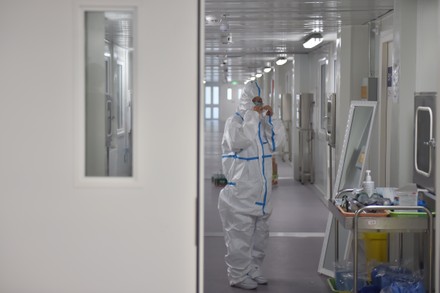 Nurse Puts On Protective Suit Outside Editorial Stock Photo - Stock ...