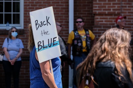 Woman Holds Back Blue Placard During Editorial Stock Photo - Stock ...