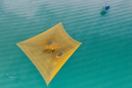 Fisherman Toils Away Beneath Large Square Editorial Stock Photo - Stock ...