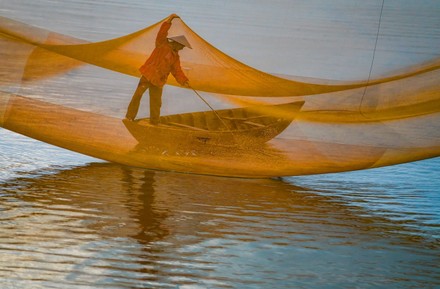 Fisherman Toils Away Beneath Large Square Editorial Stock Photo - Stock ...