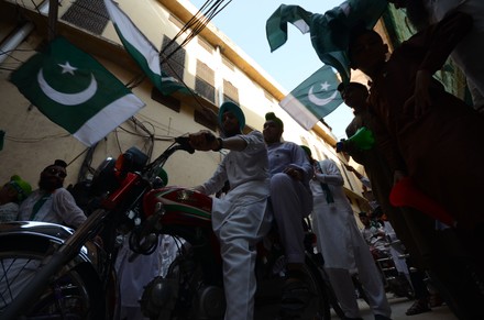 Sikh hold national flags, Peshawar, Khyber Pakhtunkhwa, Pakistan - 14 ...