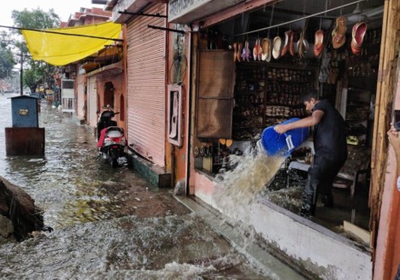 Shopkeeper Drains Shop Flooded By Rain Editorial Stock Photo - Stock ...