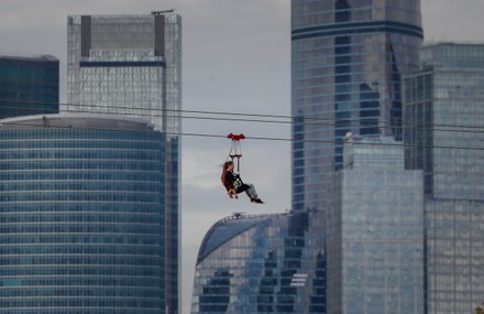 Woman Descends On Steel Rope Across Editorial Stock Photo - Stock Image ...