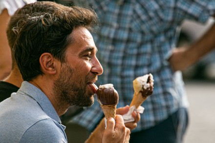 People Enjoying Ice Cream On Balmy Editorial Stock Photo - Stock Image ...