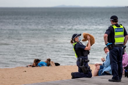 Police Officer Seen Cuddling Puppy On Editorial Stock Photo - Stock ...