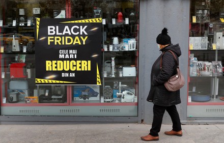 Pedestrian Walks Past Storefront Windows Displaying Editorial Stock ...