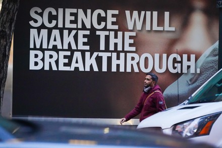 Man Walks Past Pfizer Poster That Editorial Stock Photo - Stock Image ...