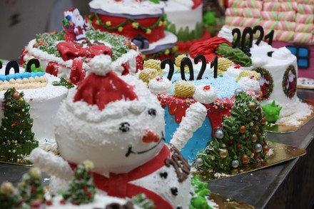 Palestinian chef Ahmed Al-Batta, put final touches on cakes which ...