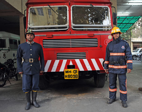 FIREFIGHTER OLD ANTIQUATED RAJ-ERA FIREFIGHTING UNIFORM Editorial Stock ...