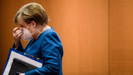 German Chancellor Angela Merkel Adjusts Her Editorial Stock Photo ...