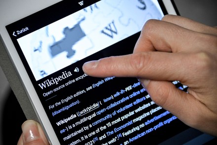 Closeup Image Shows Woman Using Wikipedia Editorial Stock Photo - Stock ...