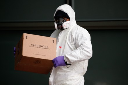 Delivery Man Wearing Ppe Suit Respirator Editorial Stock Photo - Stock ...