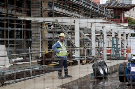 Worker Stands Inside Metal Fencing Surrounding Editorial Stock Photo ...