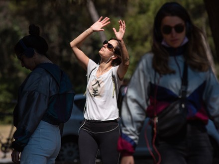 People dance with social distance and headphones in silent disco ...