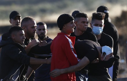 Palestinian Protesters Carry Wounded Man During Editorial Stock Photo ...