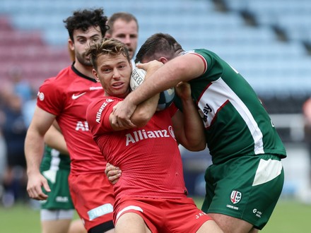 1 Matt cornish of london irish tackling alex goode of saracens Stock ...