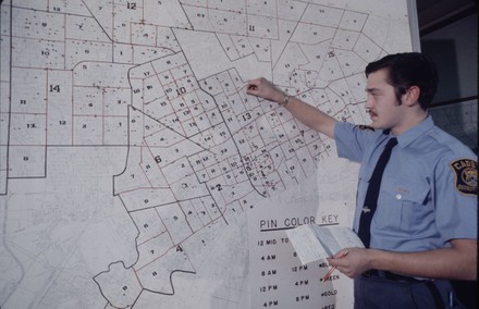 Policeman Plotting Crime Location On Map Editorial Stock Photo - Stock ...