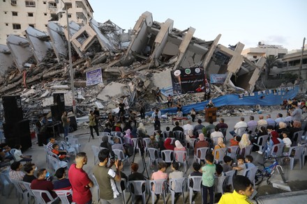 Palestinian artists perform during an event on the rubble of Hanadi ...