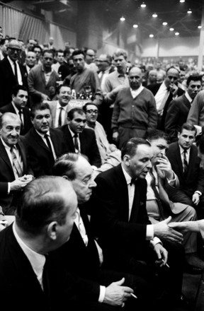 Frank Sinatra and Joe E. Lewis sitting in the crowd with heavyset ...