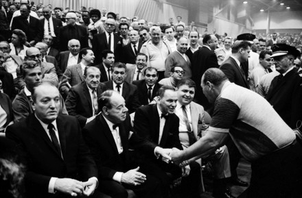 Frank Sinatra and Joe E. Lewis sitting in the crowd with heavyset ...