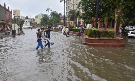 People Crossing Waterlogged Stretch During Heavy Editorial Stock Photo ...