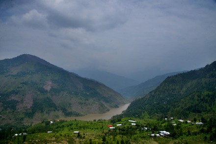 __COUNT__ A beautiful view of mountain houses along the Neelam River ...