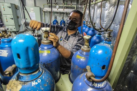 Indonesian Navy Officers Fill Oxygen Cylinders Editorial Stock Photo ...