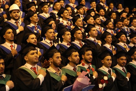 Palestinian students attend their graduation ceremony at University ...