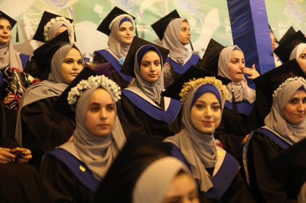 Palestinian students attend their graduation ceremony at University ...