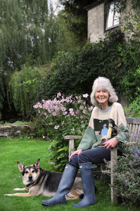 Jilly Cooper in her garden at home in the village of Bisley near Stroud ...