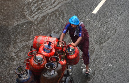 Gas Cylinder Delivery Worker Carries Out Editorial Stock Photo - Stock ...