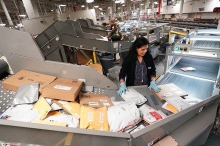 Postal Employe Sorts Packages Merrifield Processing Editorial Stock ...