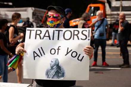 Counterprotester Carries Sign Calling Protesters Traitors Editorial ...