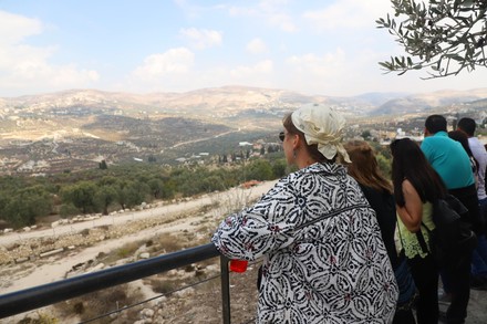 Palestinians visit the Roman basilica and forum in the village of ...
