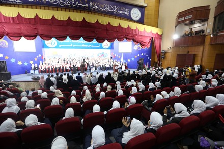 Palestinians participate in a ceremony to honor more than of 500 of ...